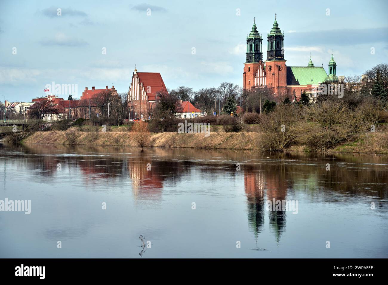 Historic buildings and towers of the gothic cathedral on the Warta ...