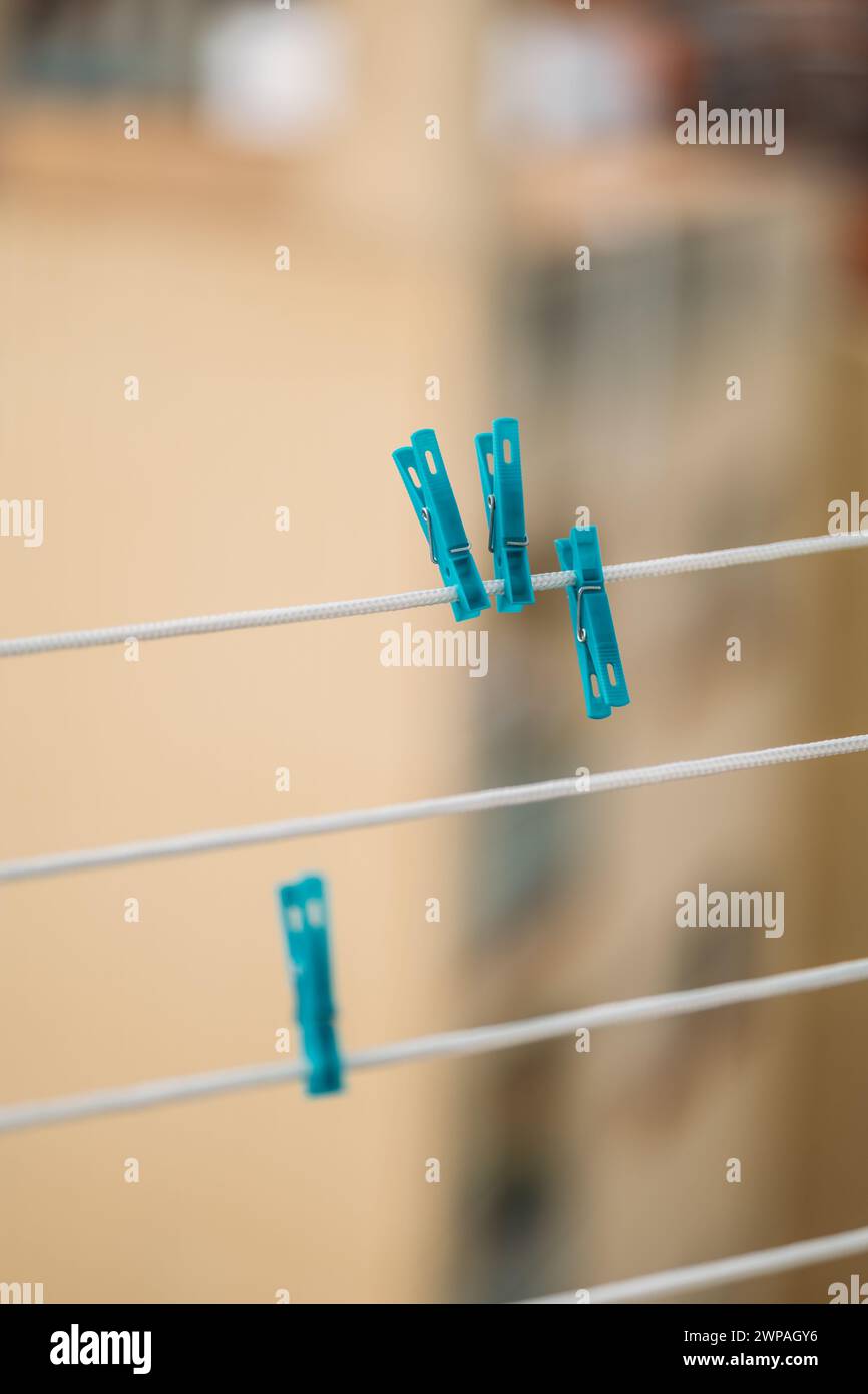 Blue Clothes Pins Are Hanging On A Clothes Line Stock Photo - Alamy