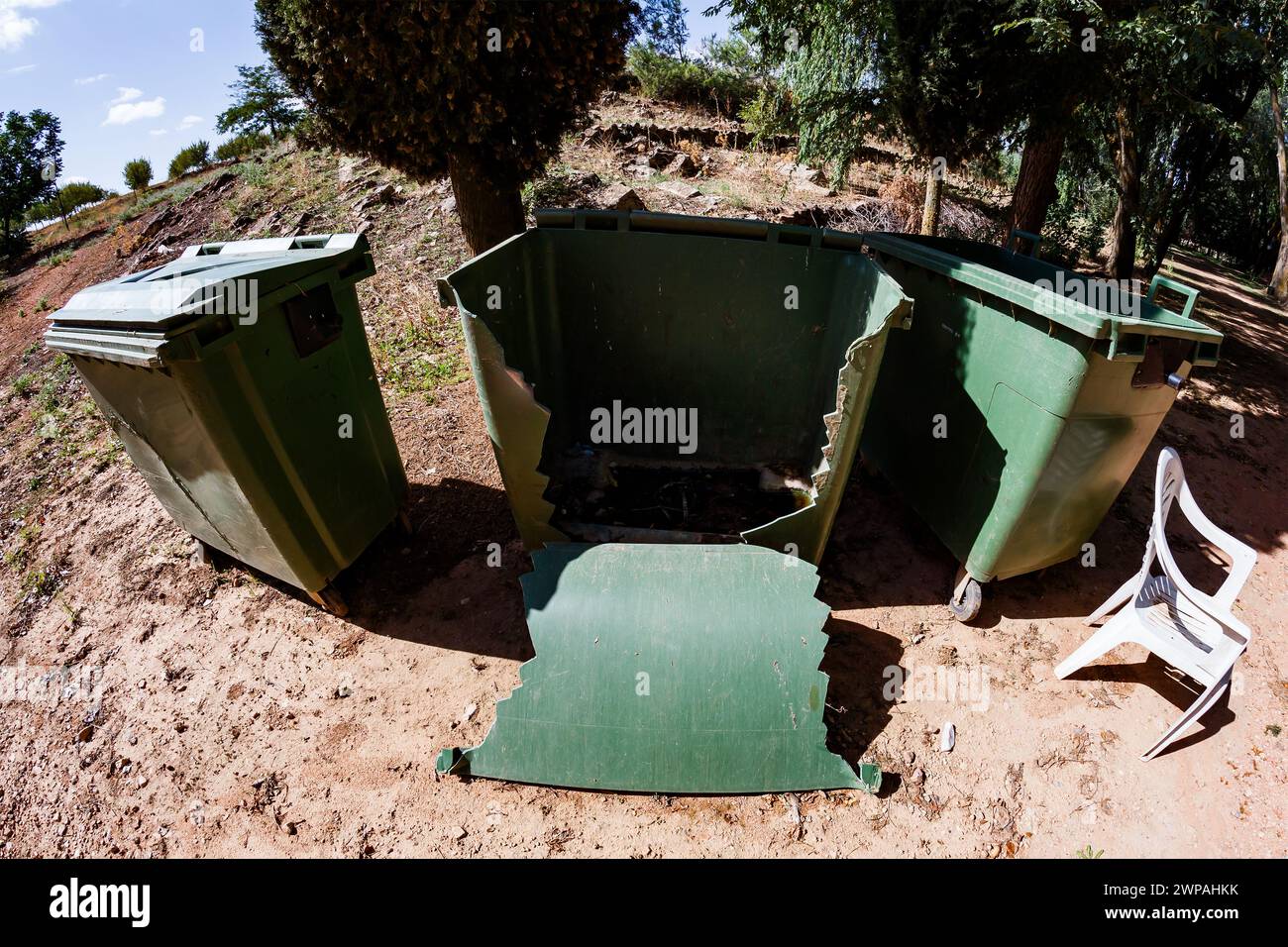 Broken rubbish bin in the forest in Viveros Stock Photo - Alamy