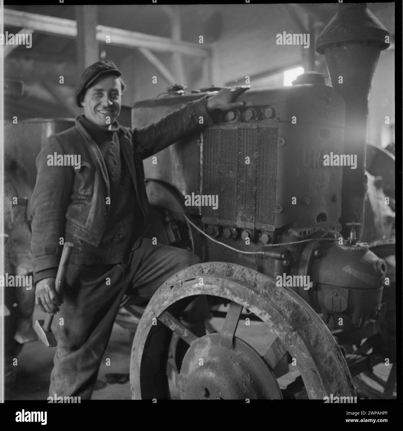 Mechanic working on farm equipment hi-res stock photography and images ...