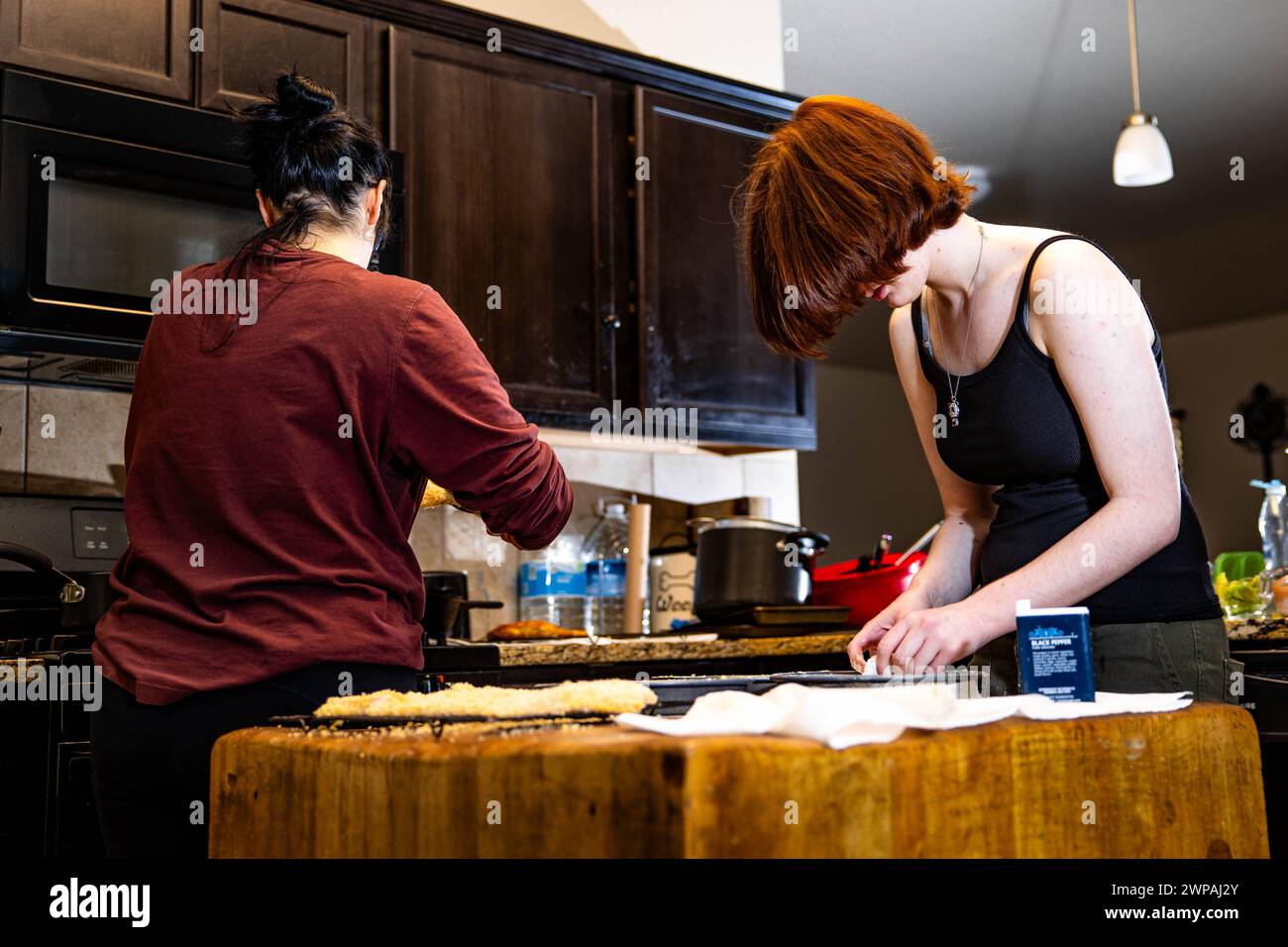 Women cooking in traditional stove hi-res stock photography and images ...
