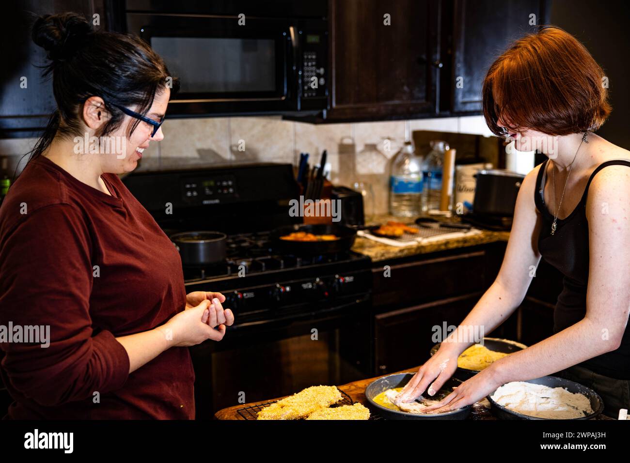 Two women with apron hi-res stock photography and images - Alamy