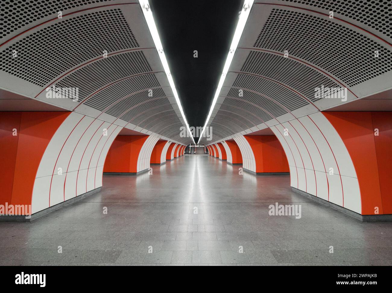 White and orange modern subway station. Perspective view of empty hall ...
