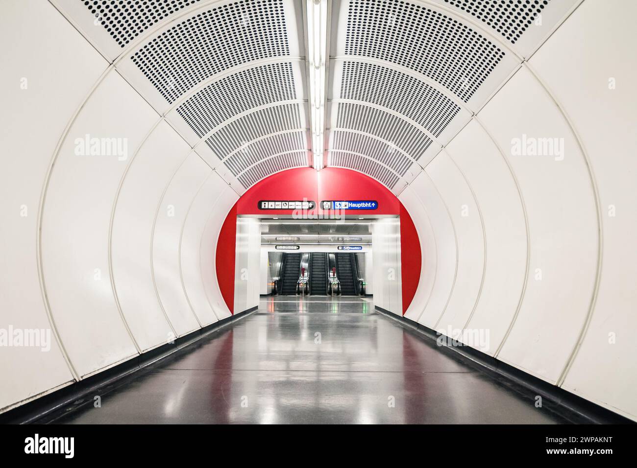Symmetric view of subway station walkway tunnel. Perspective view of ...
