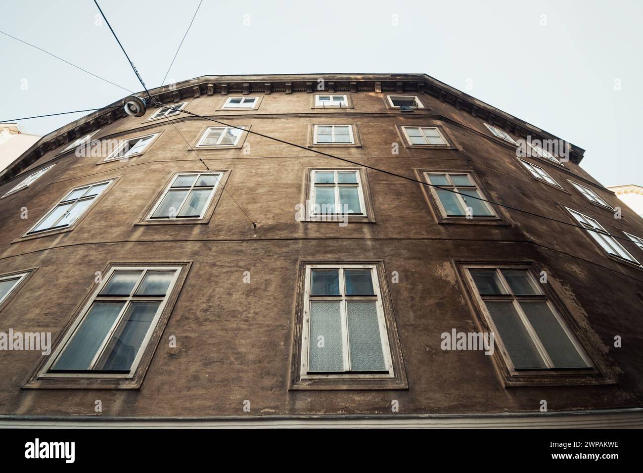 Looking up at the facade of brown house. Facade of 18th century 4-story ...