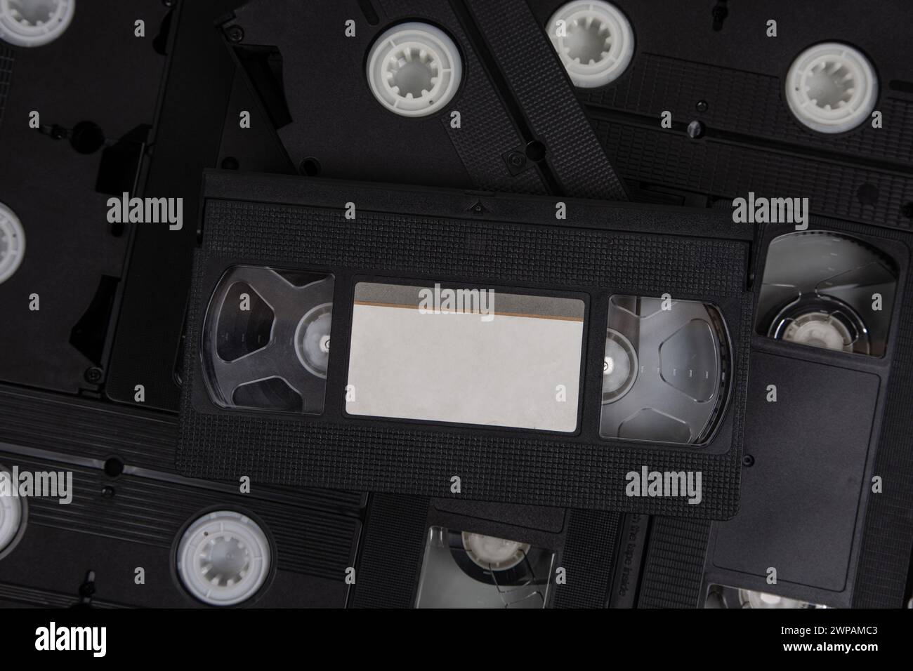 Videotape with blank tags. Pile of VHS video cassettes. Vintage media ...