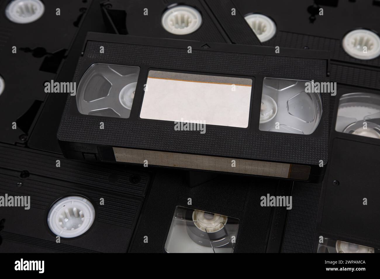 Videotape with blank tags. Pile of VHS video cassettes. Vintage media ...