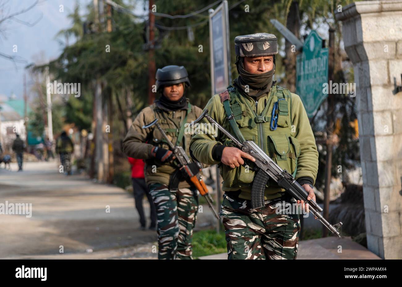 Indian paramilitary troopers patrol along a street ahead of Prime ...