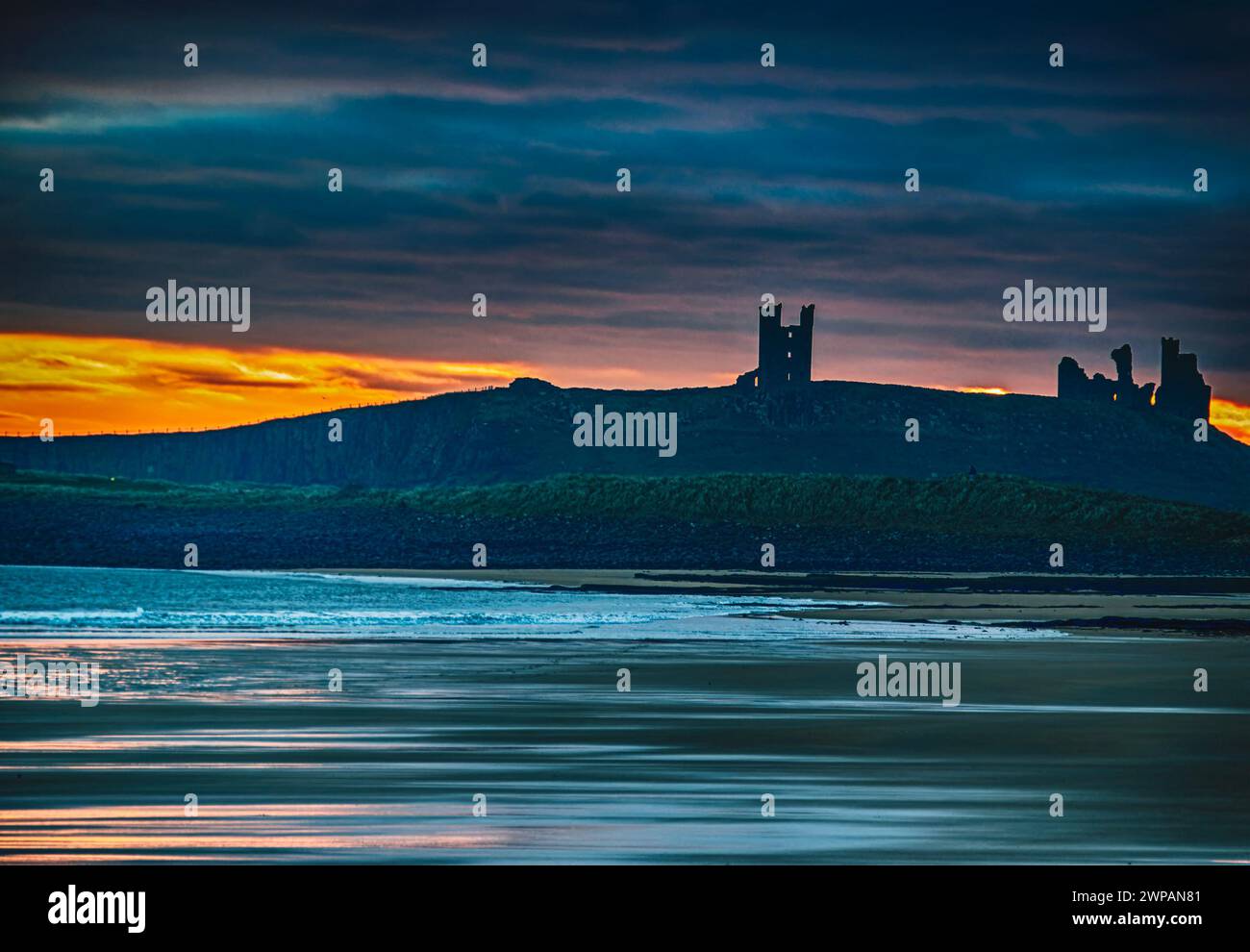 Dunstanburgh Castle seen at dawn Stock Photo - Alamy