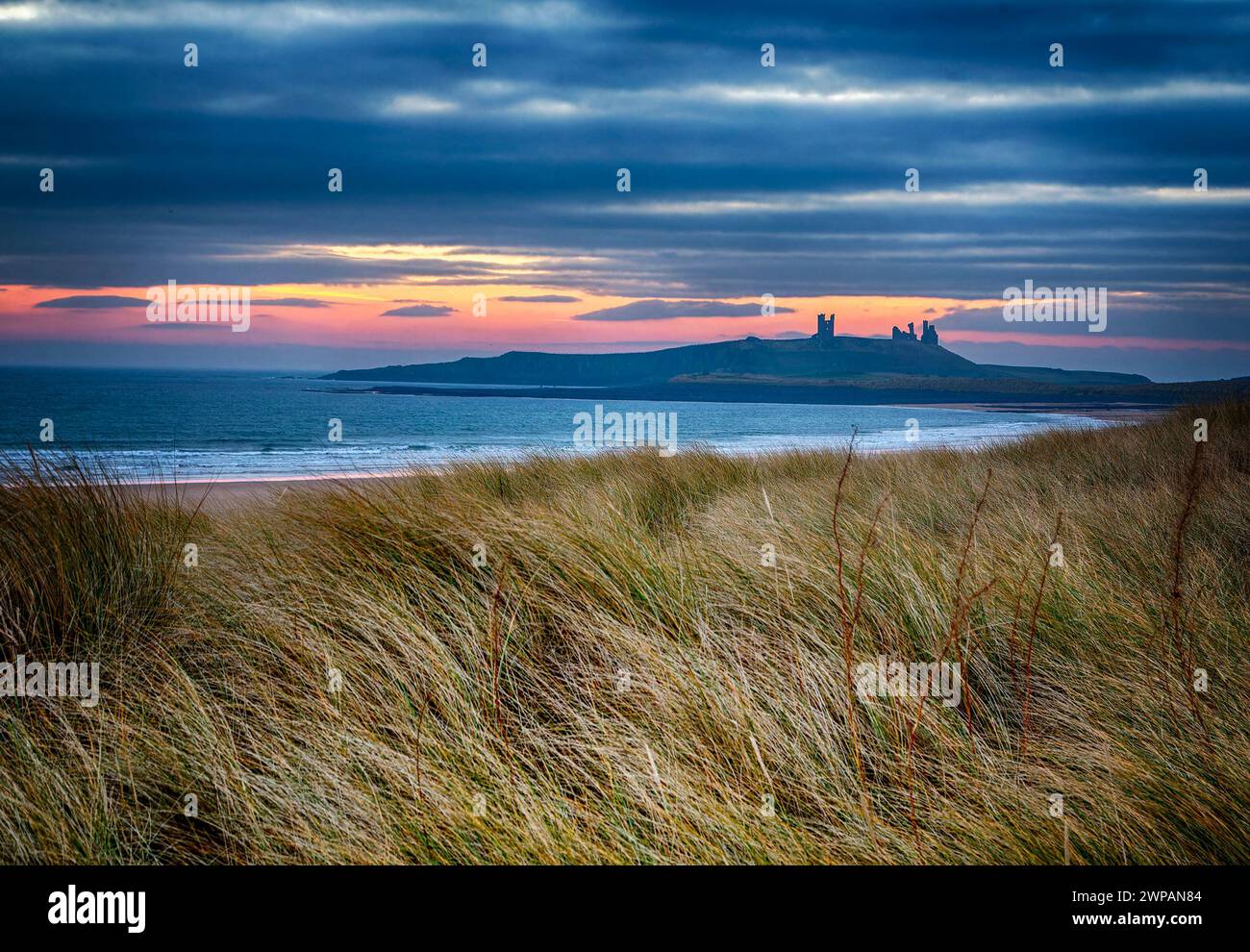 Dunstanburgh Castle seen at dawn Stock Photo - Alamy