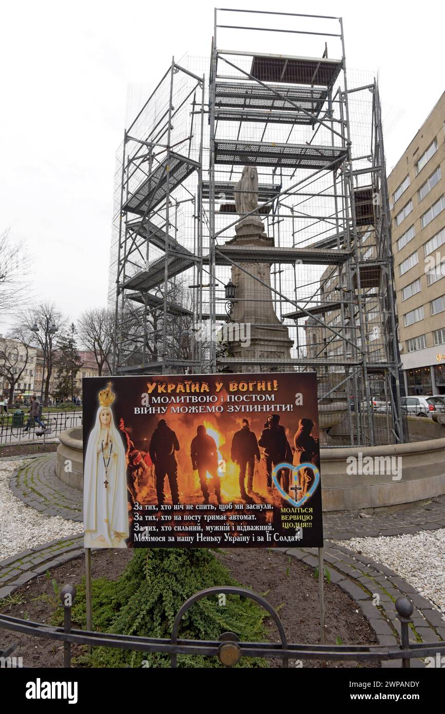 A statue covered in scaffolding and mesh to protect against missile ...