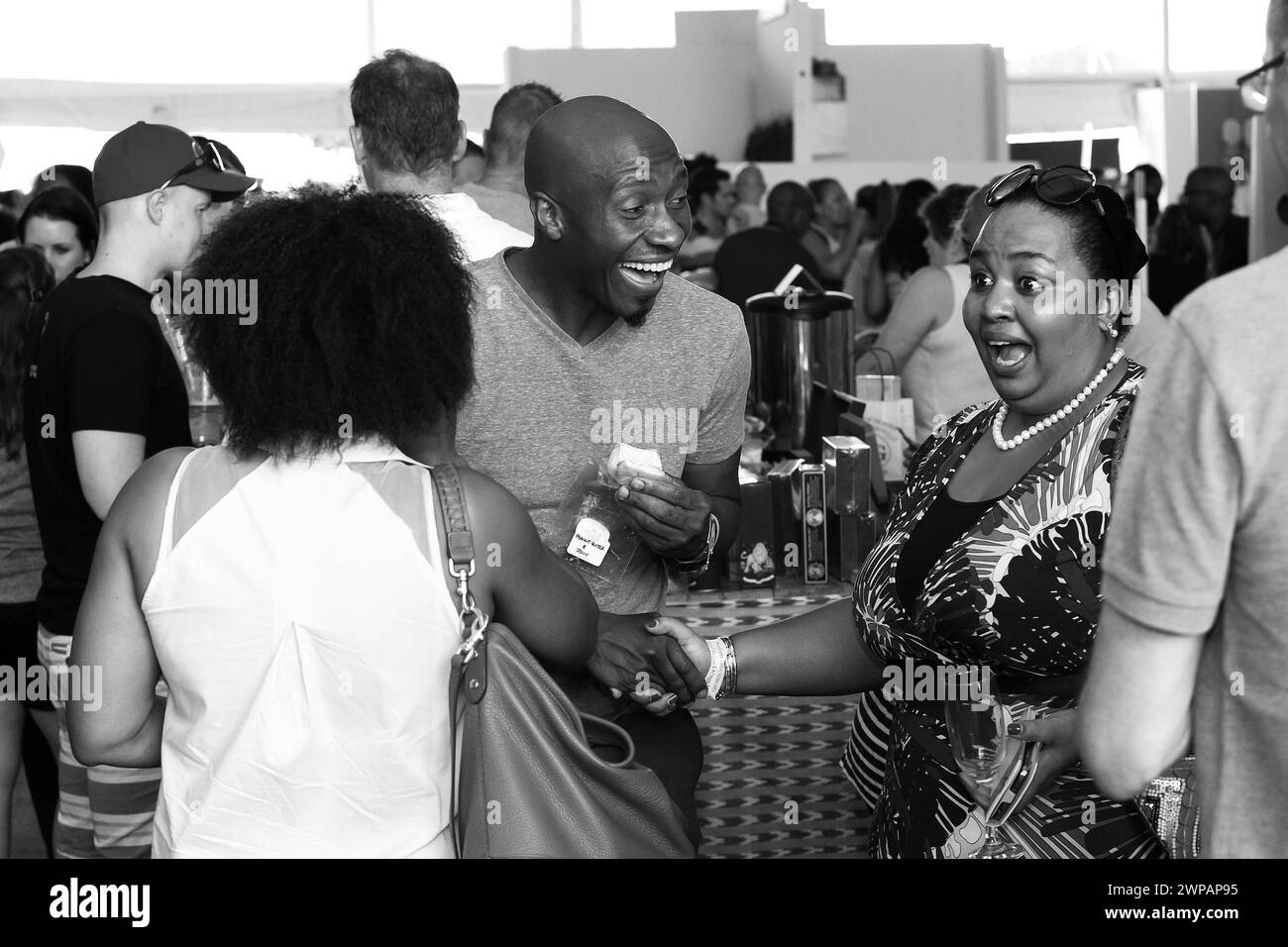 An Excited crowd discussing common topics at a party Stock Photo - Alamy