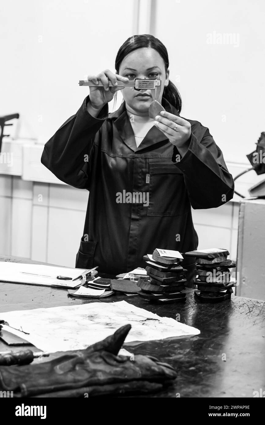 A woman measuring a very small detail Stock Photo - Alamy