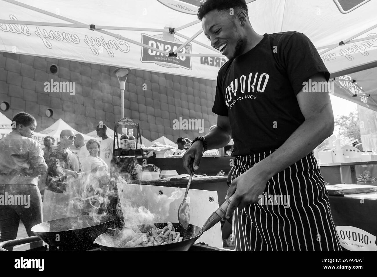Man cooking food on Black and White Stock Photos & Images - Alamy