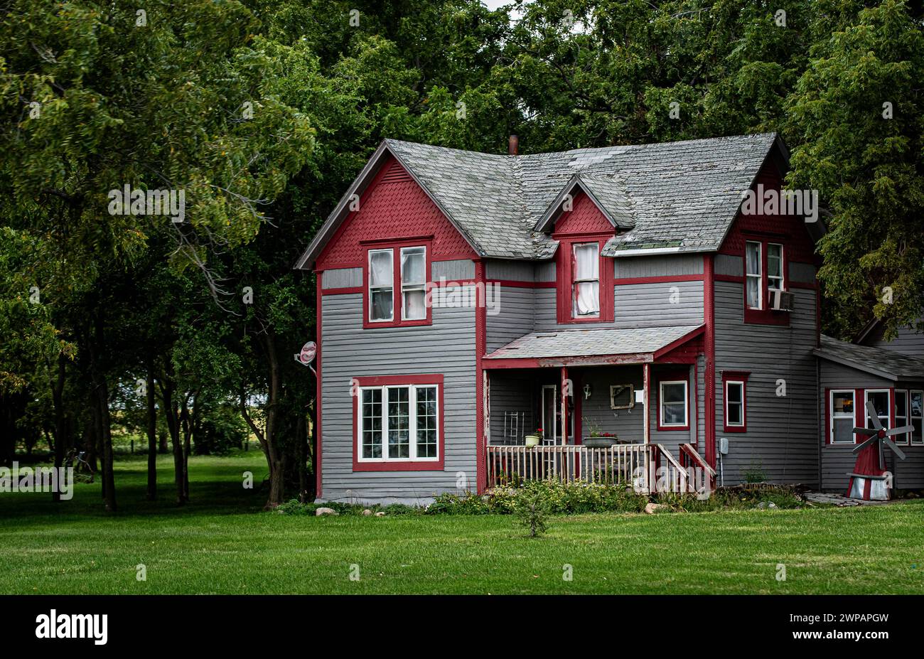 Vintage red and gray house on street side Stock Photo - Alamy