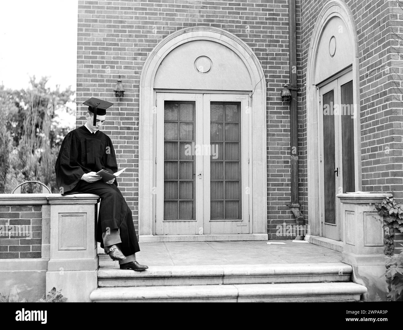 John Cockle in cap and gown on graduation day, University of Nebraska ...