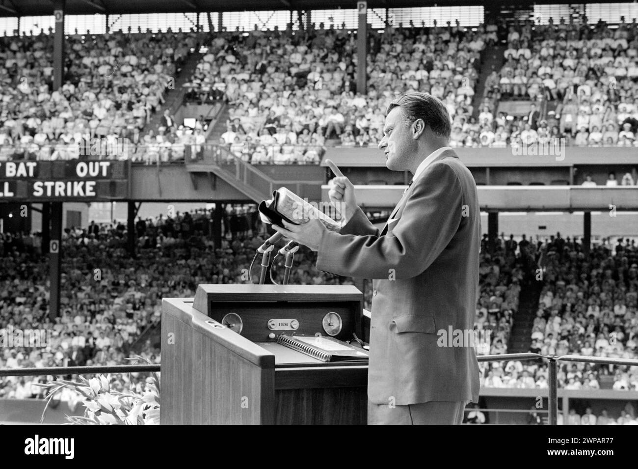 Evangelist Billy Graham preaching to crowd at crusade, Griffith Stadium ...