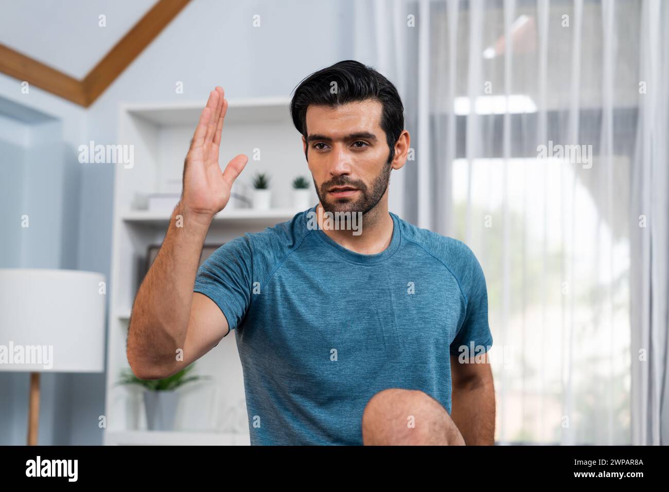 Athletic and sporty man running posture at home body workout exercise ...