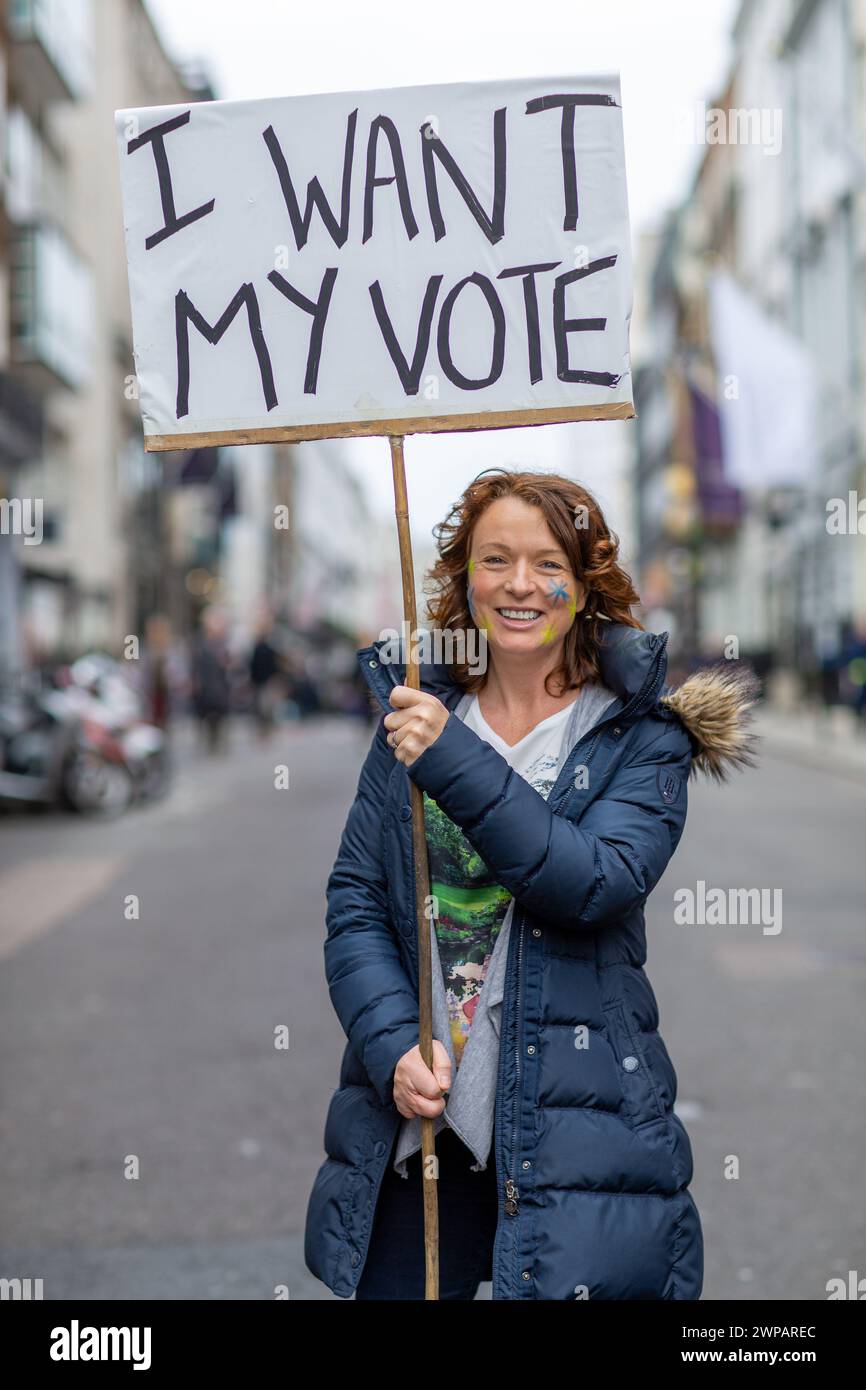 woman holding sign I want my vote Stock Photo - Alamy