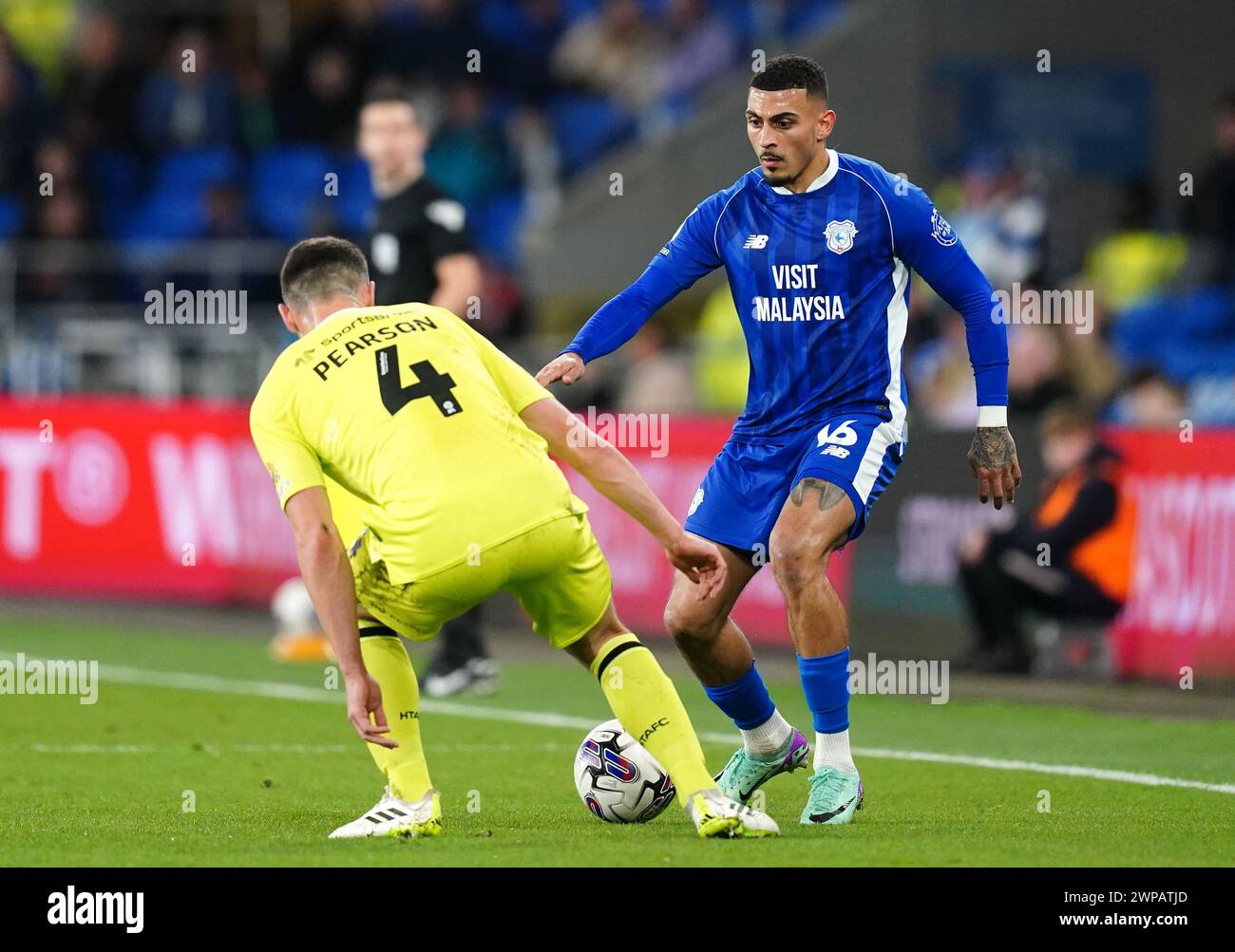 Huddersfield Town's Matty Pearson (left) and Cardiff City's Karlan ...
