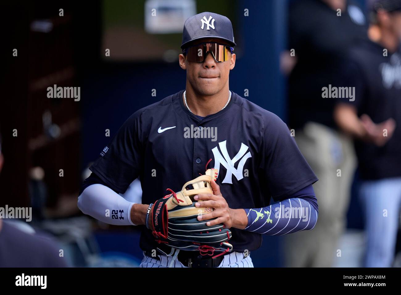 New York Yankees right fielder Juan Soto walks in the dugout before a ...