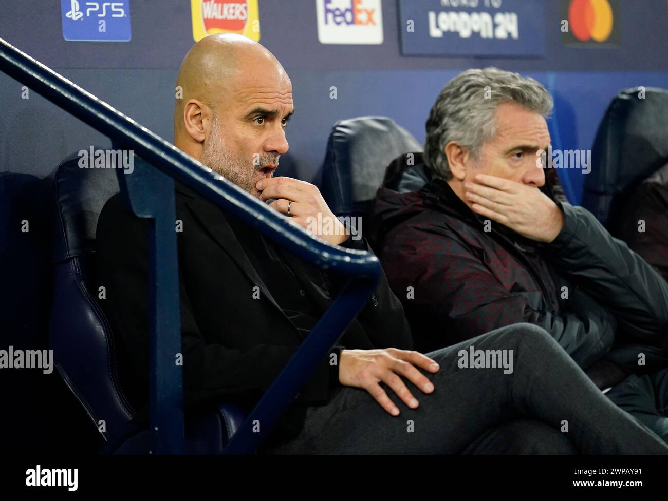 Manchester City manager Pep Guardiola (left) and assistant Juan Manuel ...