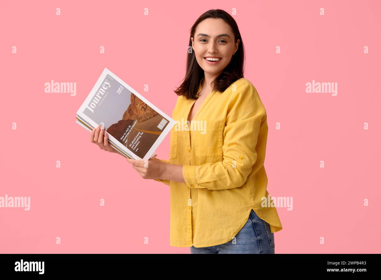 Beautiful woman with magazine on pink background Stock Photo - Alamy