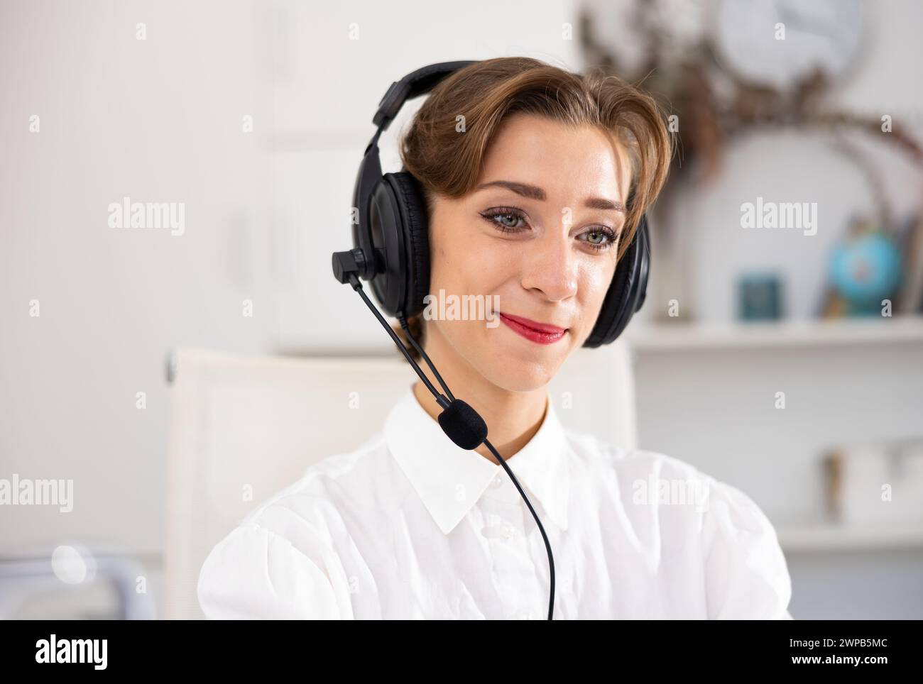 Portrait of positive woman call center worker Stock Photo - Alamy