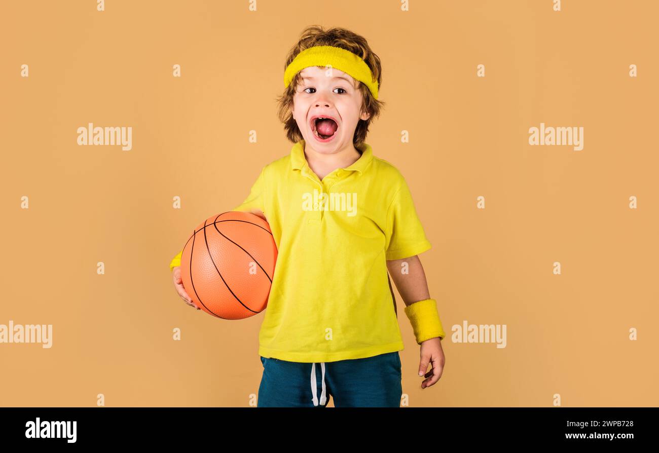 Sporty child boy in sportswear with basketball ball. Healthy lifestyle ...