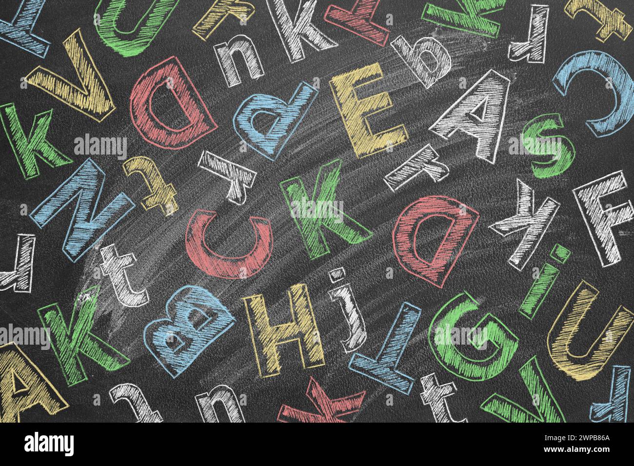 Uppercase and lowercase Latin color letters are written in chalk on a ...