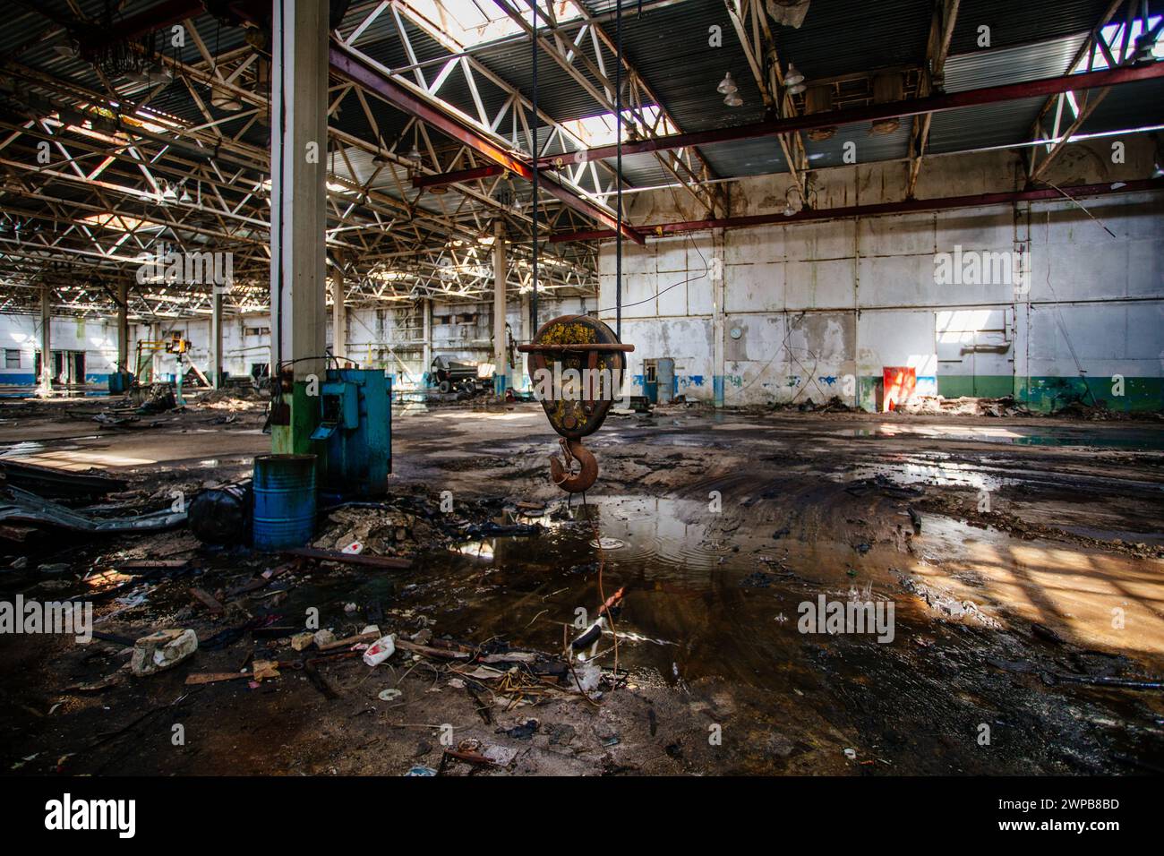 Abandoned factory. Large empty ruined industrial hall with broken ...