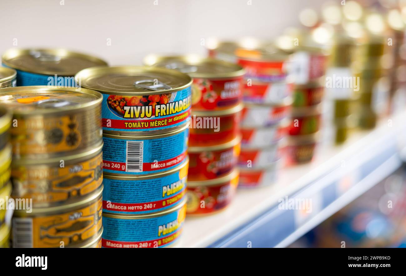 Russian goods store shelves have wide range of canned sprats in oil and ...
