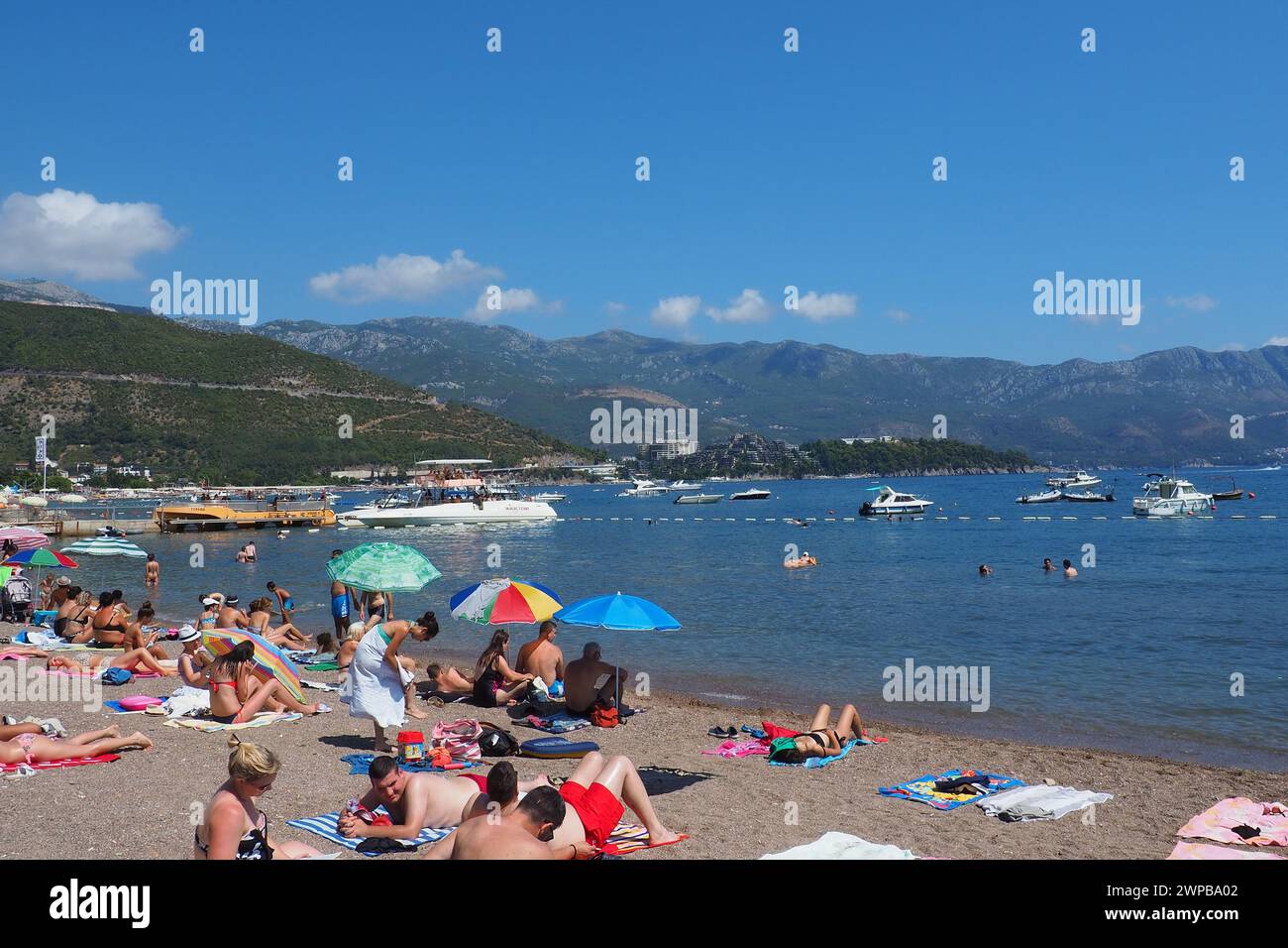 Budva, Montenegro 8.15.22 Pebble concrete public beach Adriatic sea Mediterranean. Beach ...