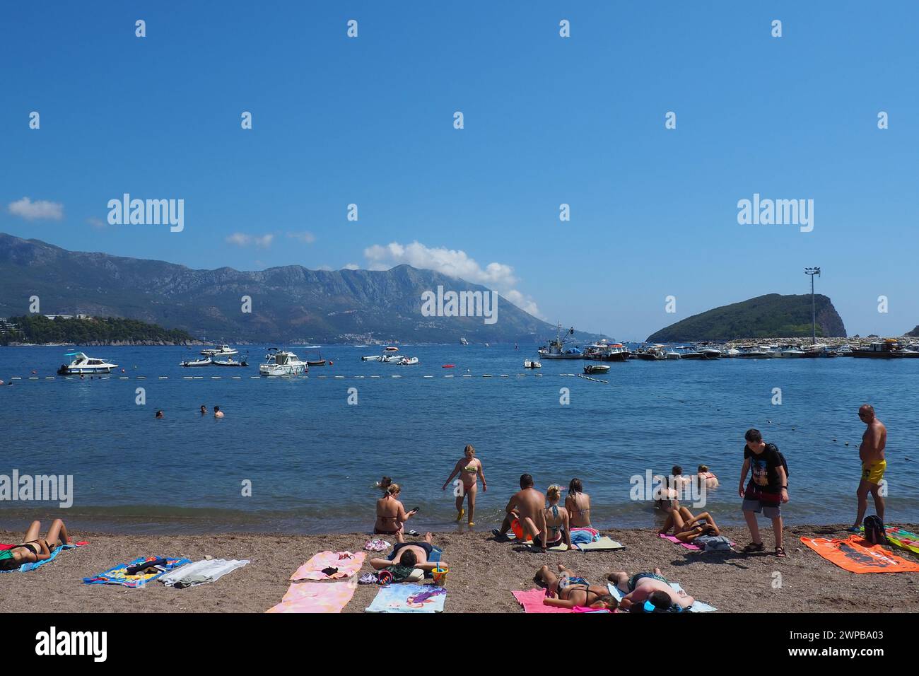 Budva, Montenegro 8.15.22 Pebble concrete public beach Adriatic sea Mediterranean. Beach ...