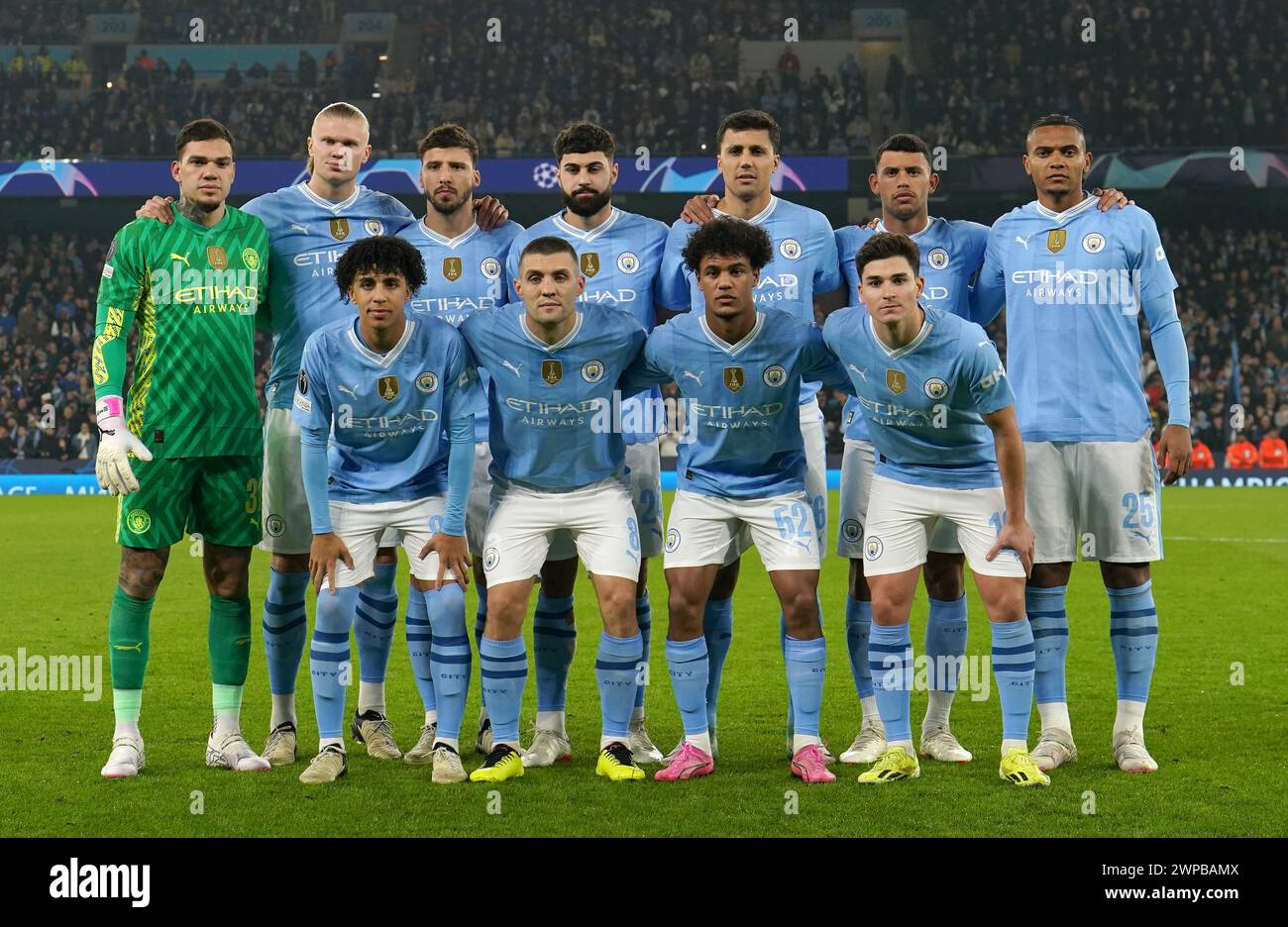 Manchester City players, back row, left to right, Ederson, Erling ...