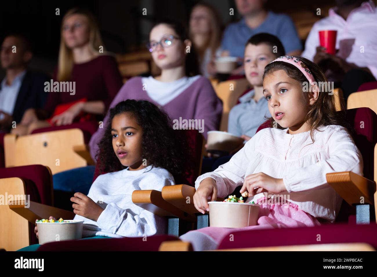kids sitting at movie in auditorium in cinema Stock Photo - Alamy
