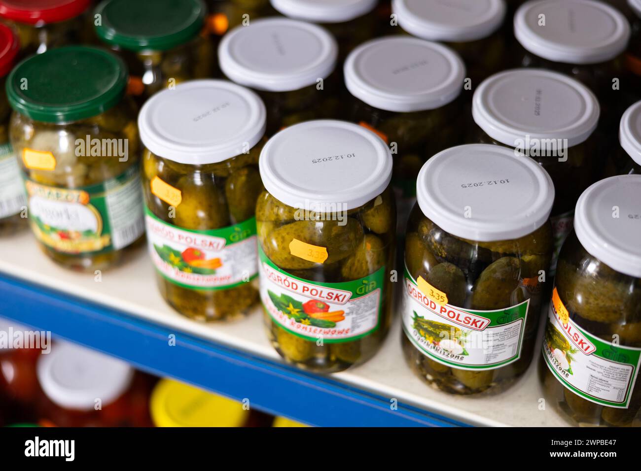 Russian goods store shelves have glass jar with canned pickled ...