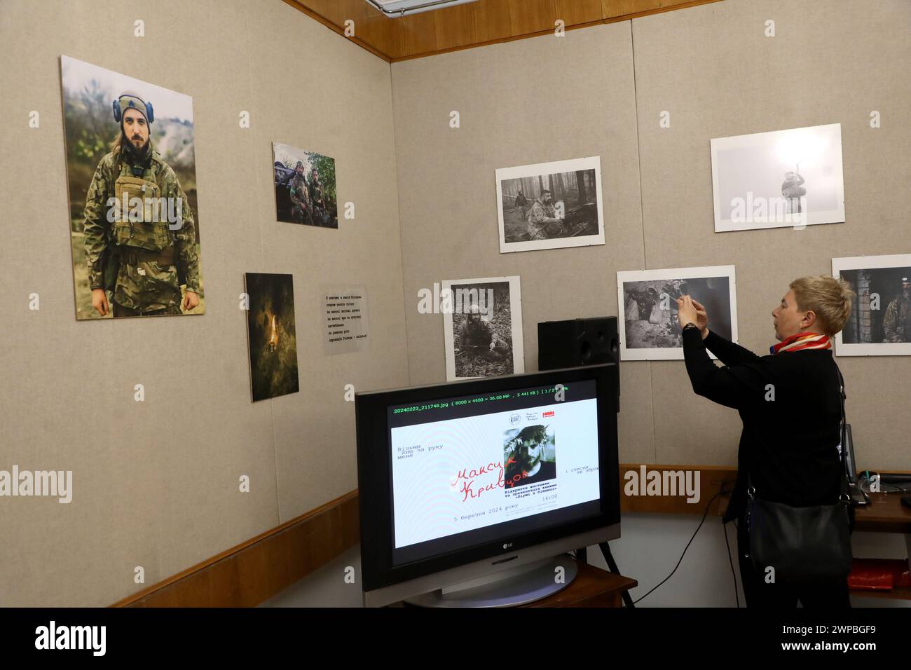 Non Exclusive: KYIV, UKRAINE - MARCH 5, 2024 - A woman takes a picture ...