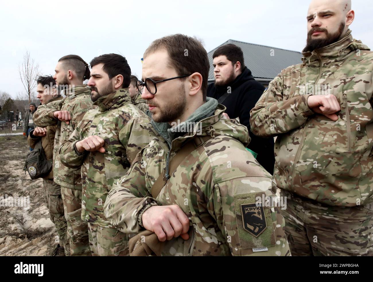Non Exclusive: BUCHA, UKRAINE - MARCH 5, 2024 - Servicemen stand to ...