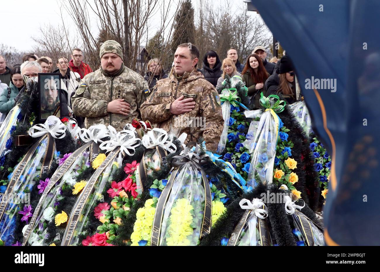 Non Exclusive: BUCHA, UKRAINE - MARCH 5, 2024 - Servicemen stand to ...
