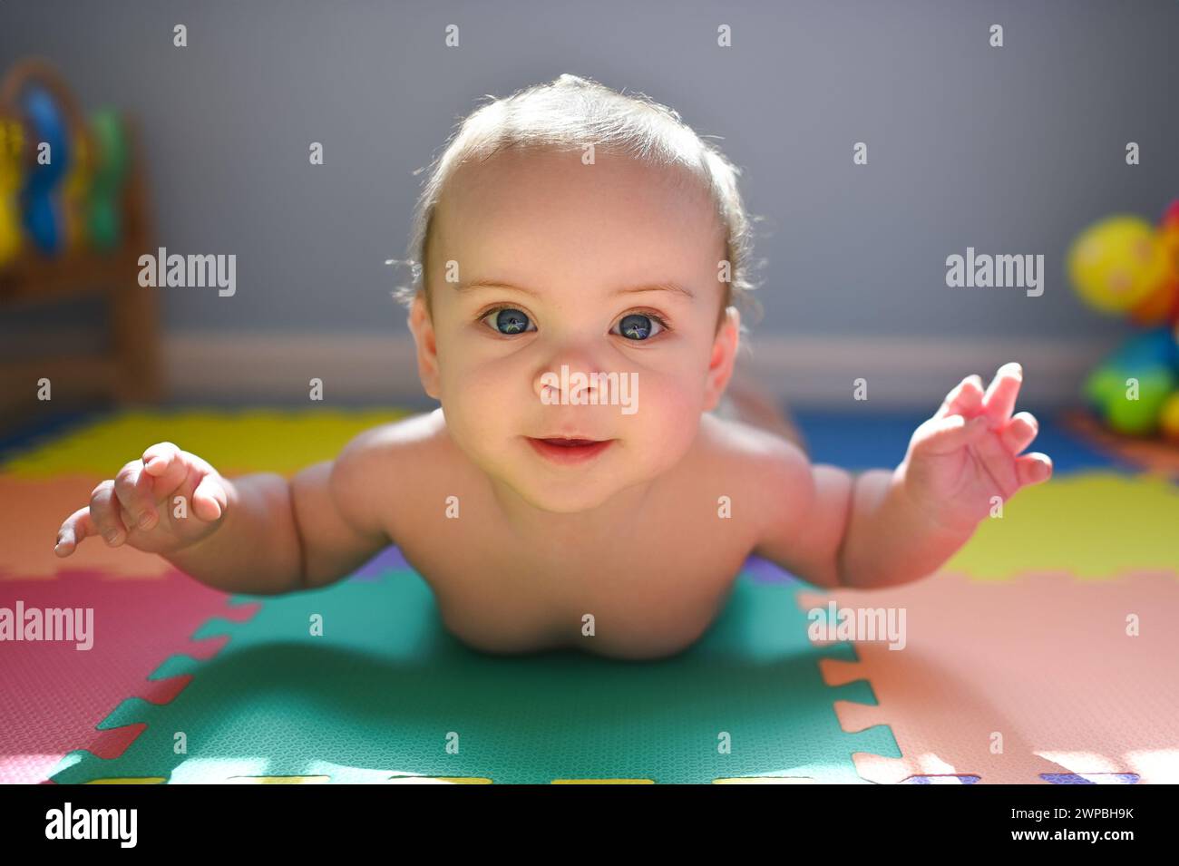 Adorable smiling cute funny happy infant baby in diaper crawling and ...