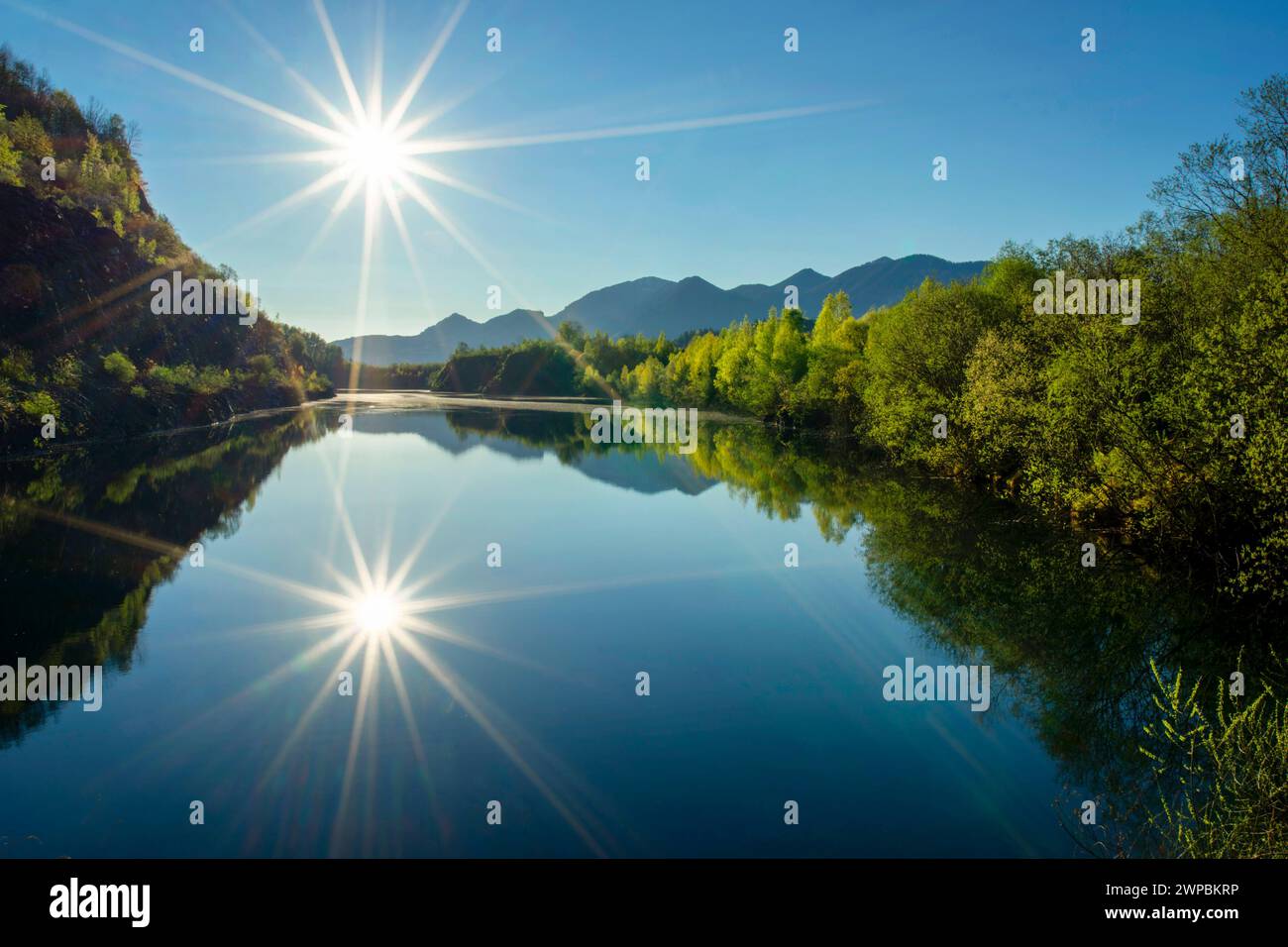 sunrise at one of the many small lakes in the Murnauer Moos, Germany ...