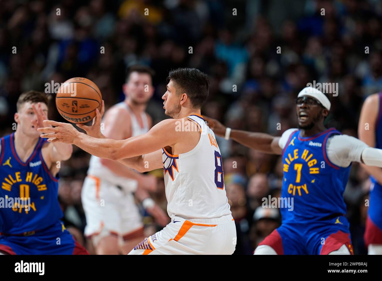 Phoenix Suns guard Grayson Allen (8) and Denver Nuggets guard Reggie ...