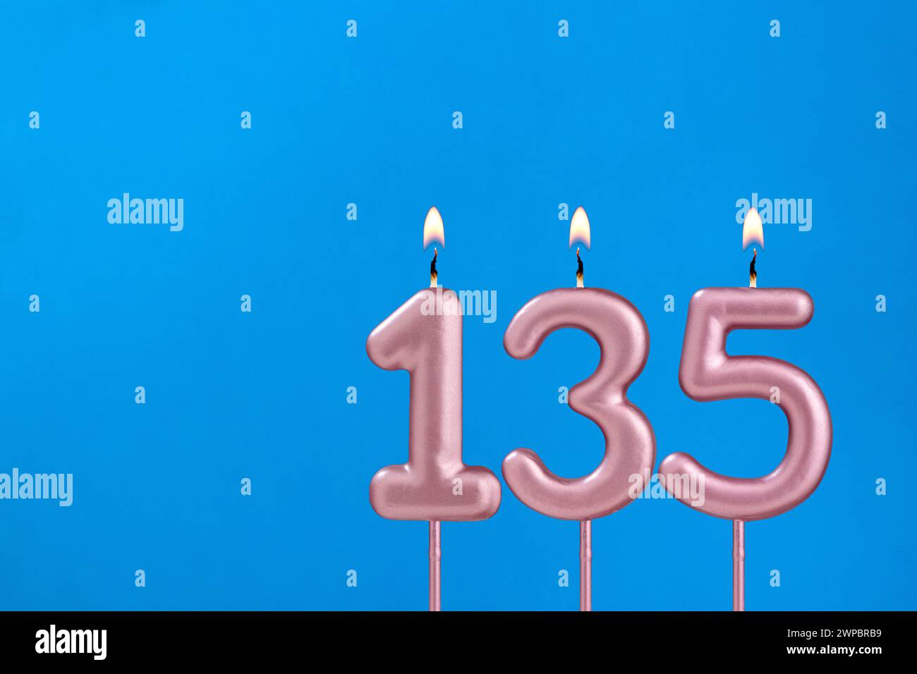 Birthday card with number 135 - Burning anniversary candle on blue ...