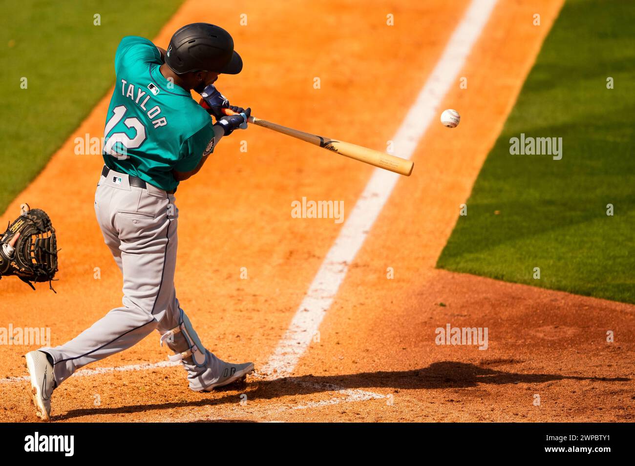 Seattle Mariners' Samad Taylor hits a two-run single against the Kansas ...