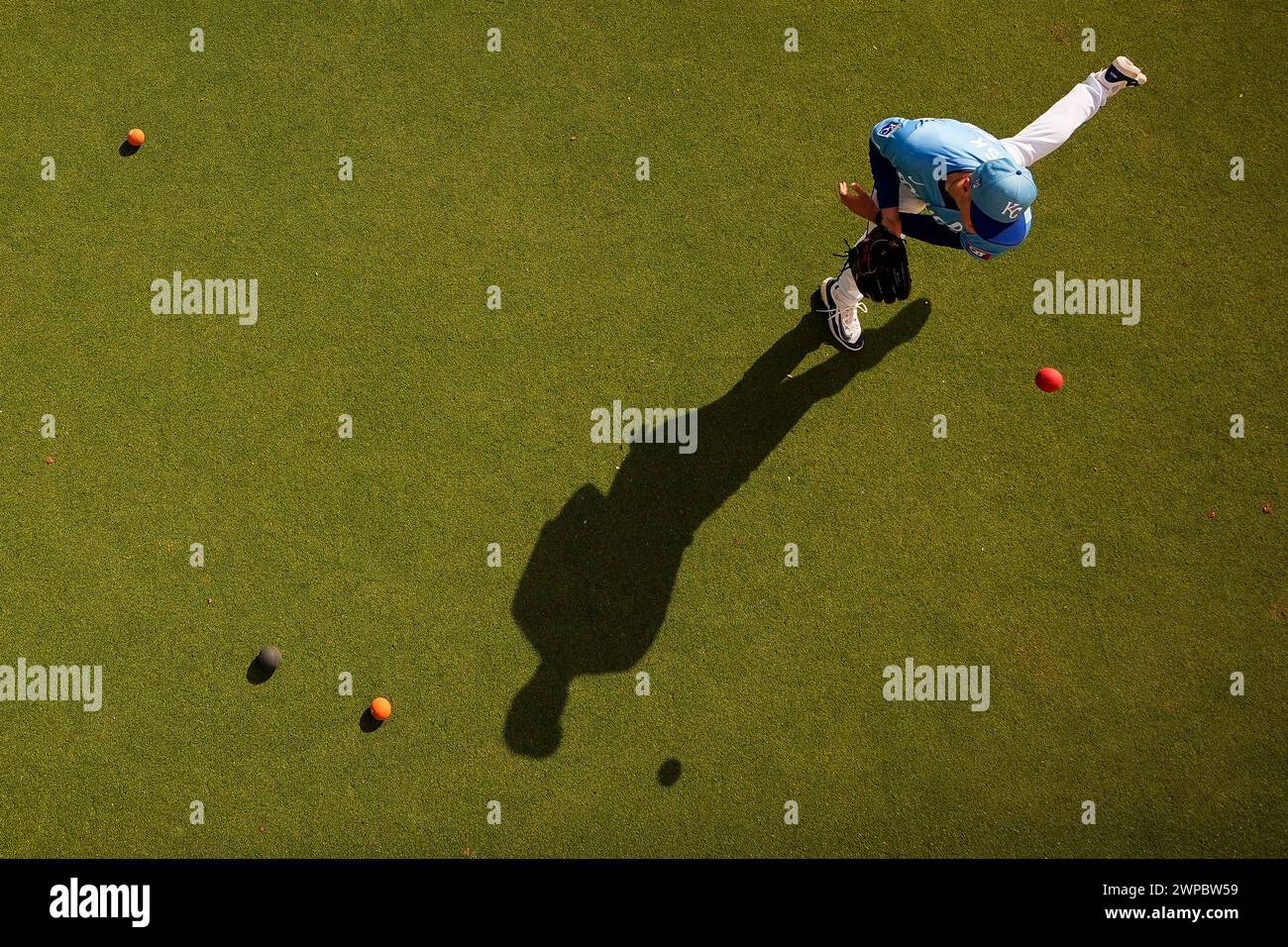 Kansas City Royals pitcher Evan Sisk throws a rubber ball against the ...