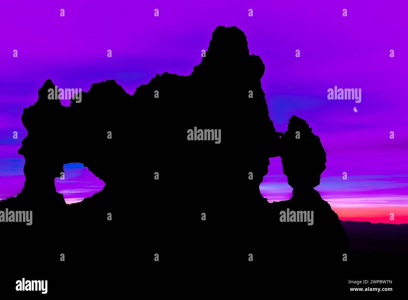 crescent moon and venus in the morning sky above a double window ...