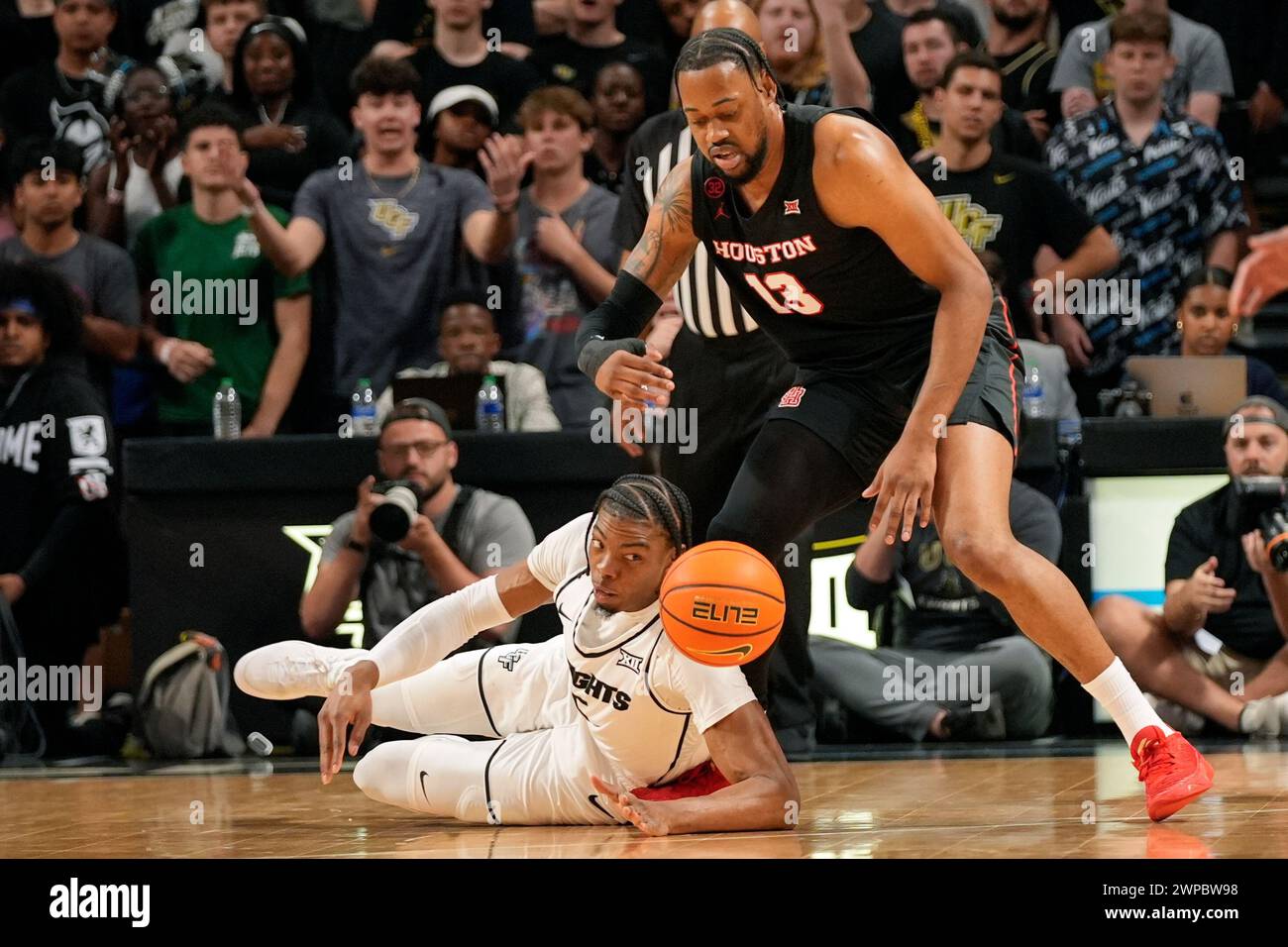Central Florida forward Omar Payne, left, and Houston forward J'Wan ...