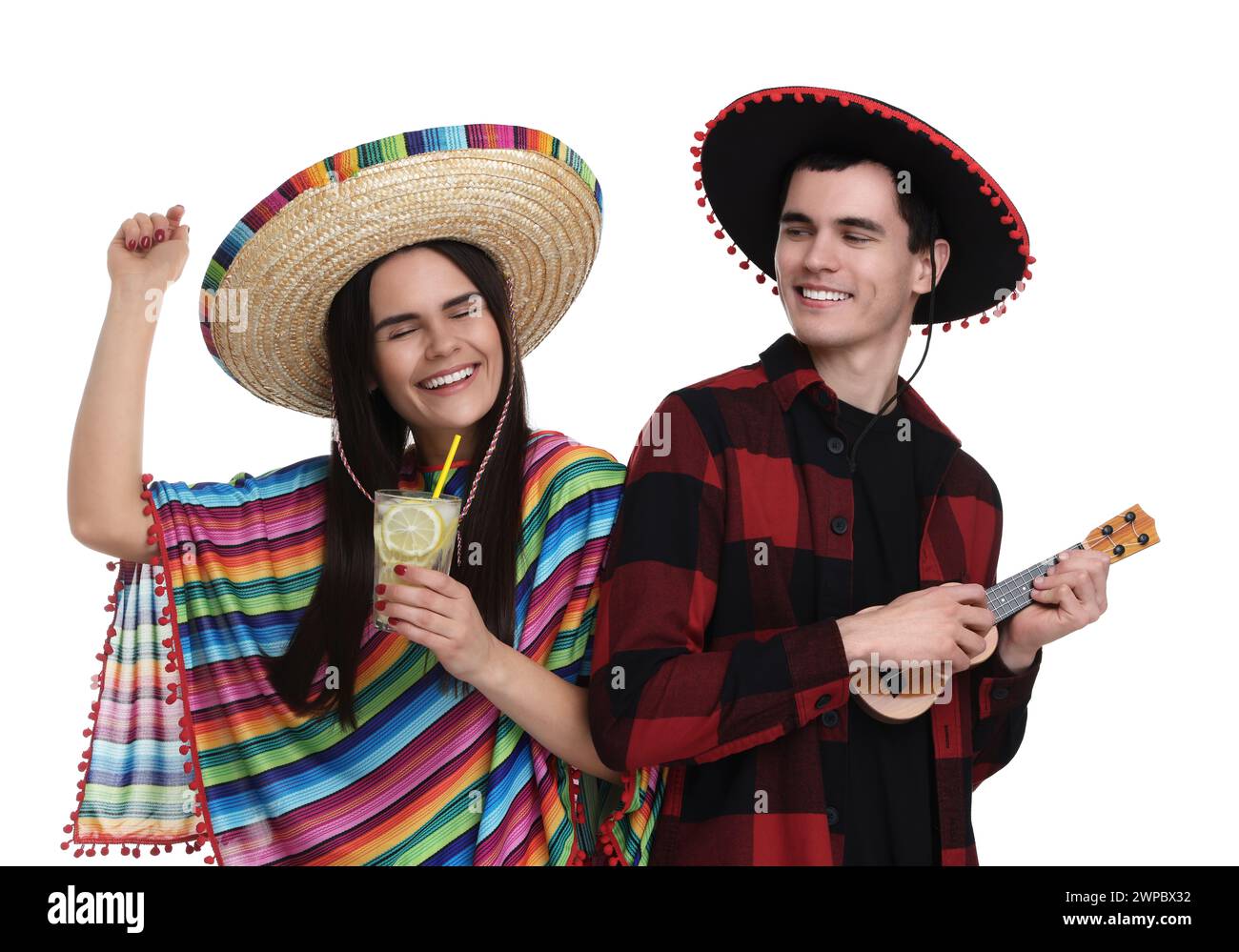 Lovely couple in Mexican sombrero hats with cocktail and ukulele on ...