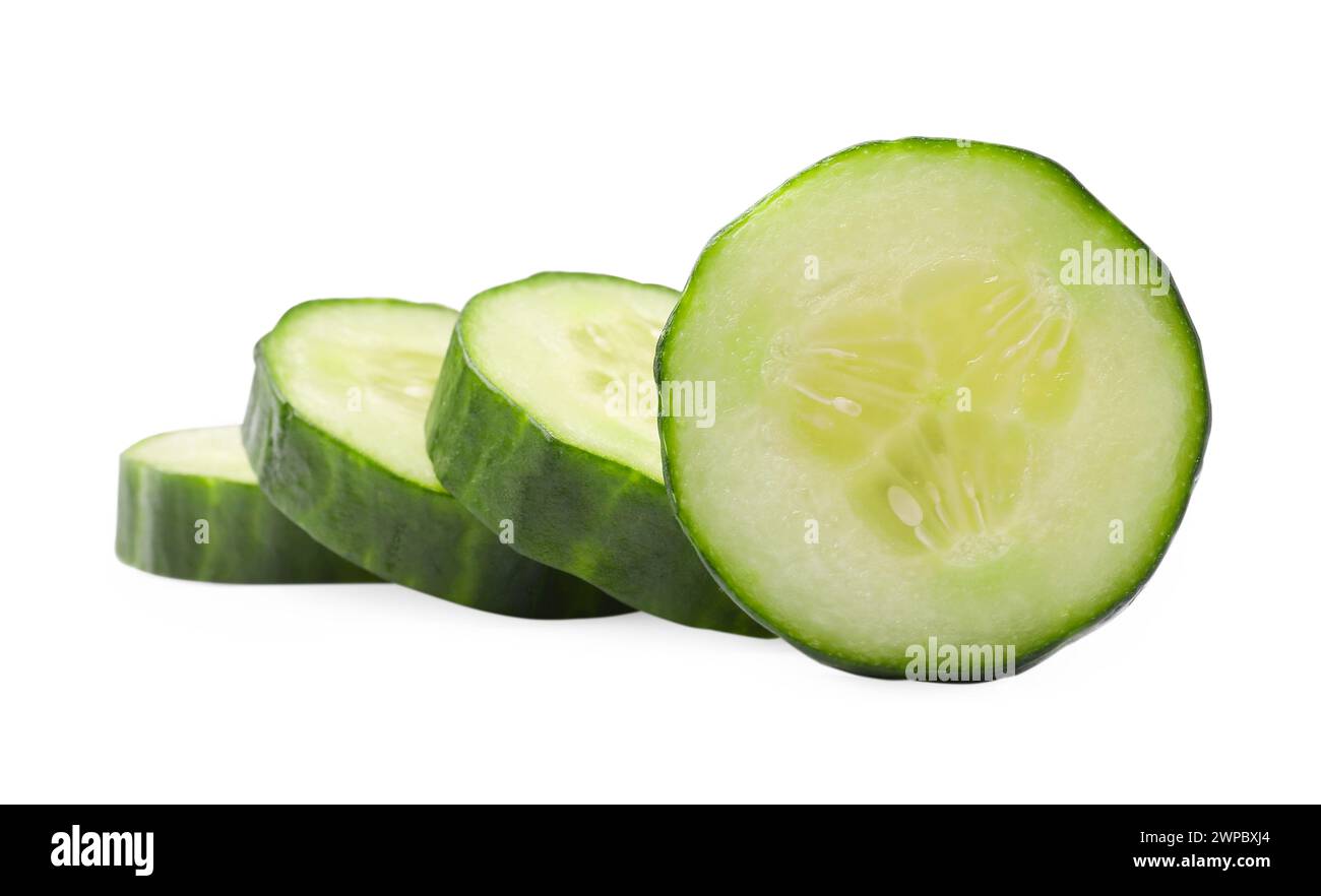 Slices of long cucumber isolated on white Stock Photo - Alamy